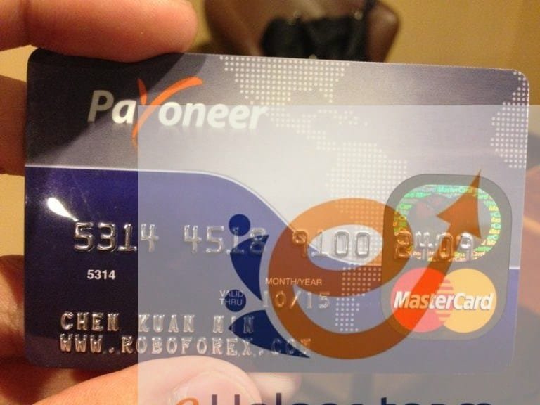 Explain Payoneer and how to register on the site and get a Payoneer card